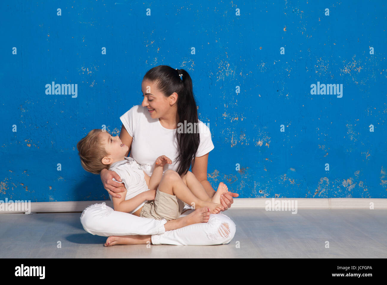 mom keeps her son at the hands of play hug Stock Photo - Alamy