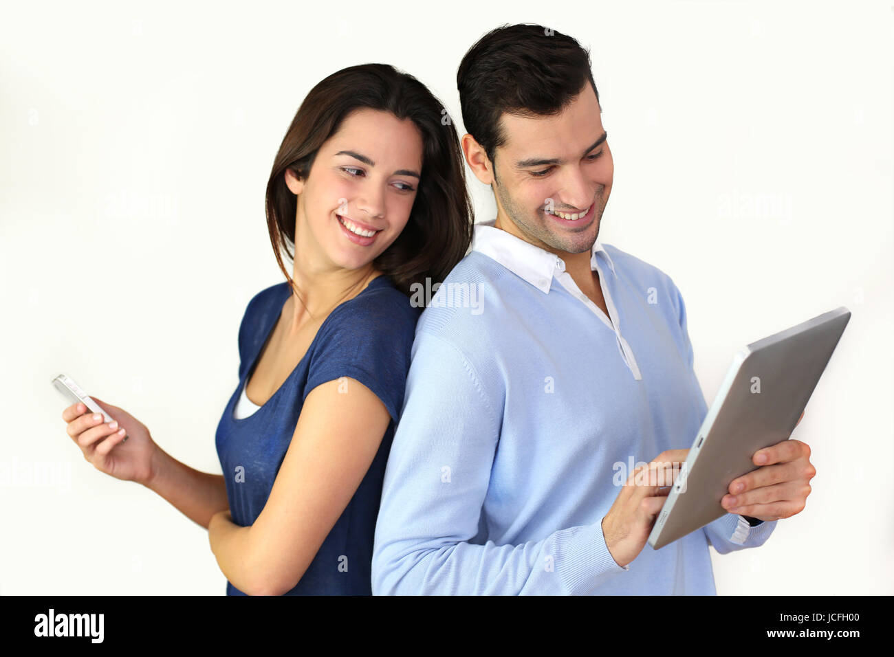 Couple websurfing on internet with new technologies Stock Photo - Alamy
