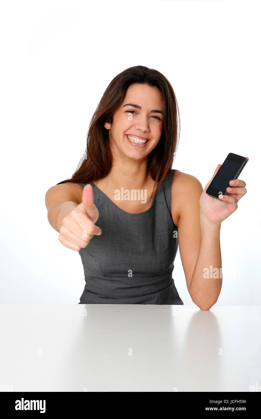Young woman with smartphone showing thumb up Stock Photo - Alamy