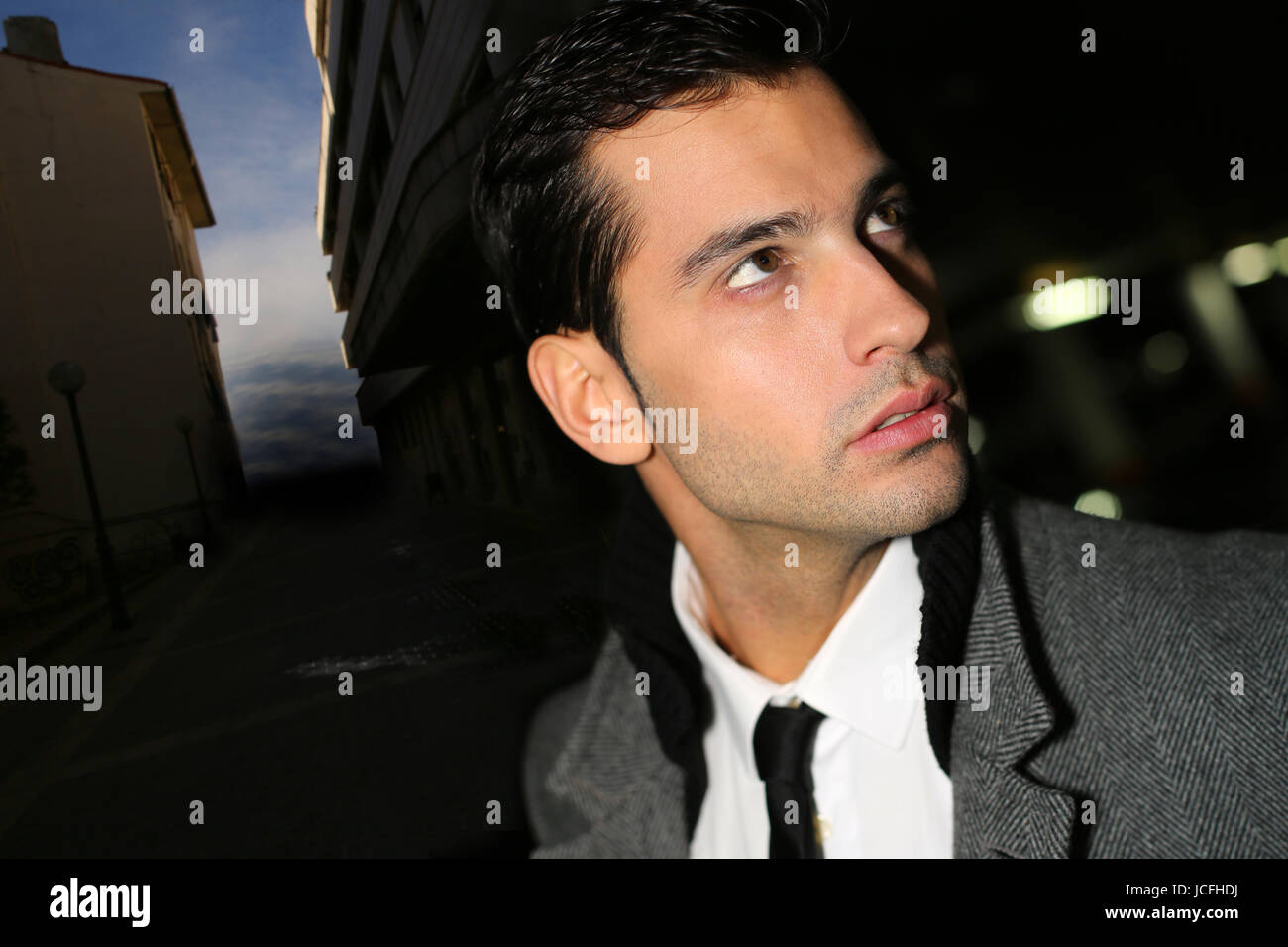 Handsome guy standing in the street by night Stock Photo - Alamy