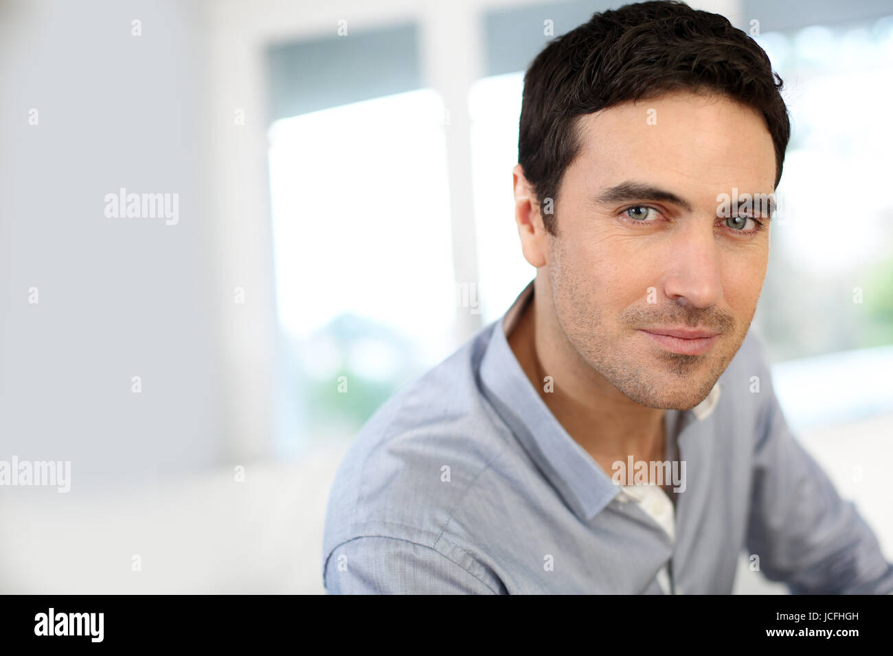 Portrait of handsome man with blue eyes Stock Photo - Alamy