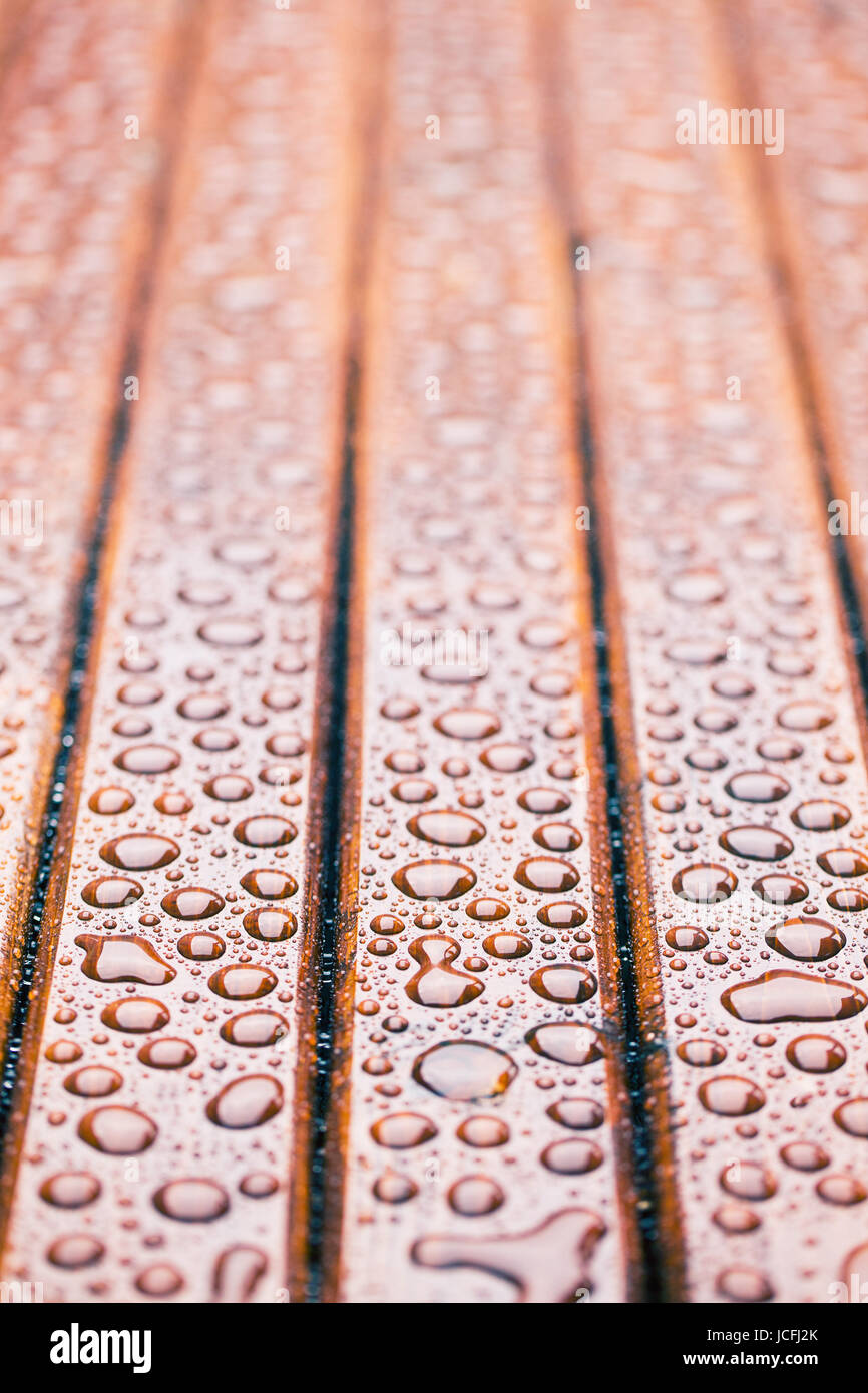the water drops on wooden garden table Stock Photo - Alamy