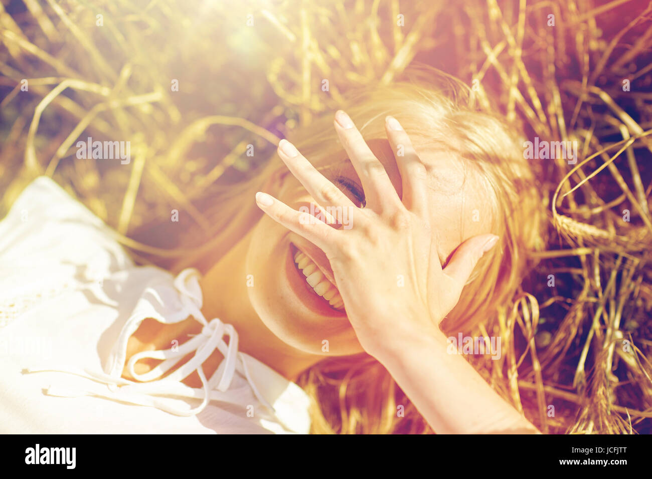Teen girl lying on field hi-res stock photography and images - Alamy