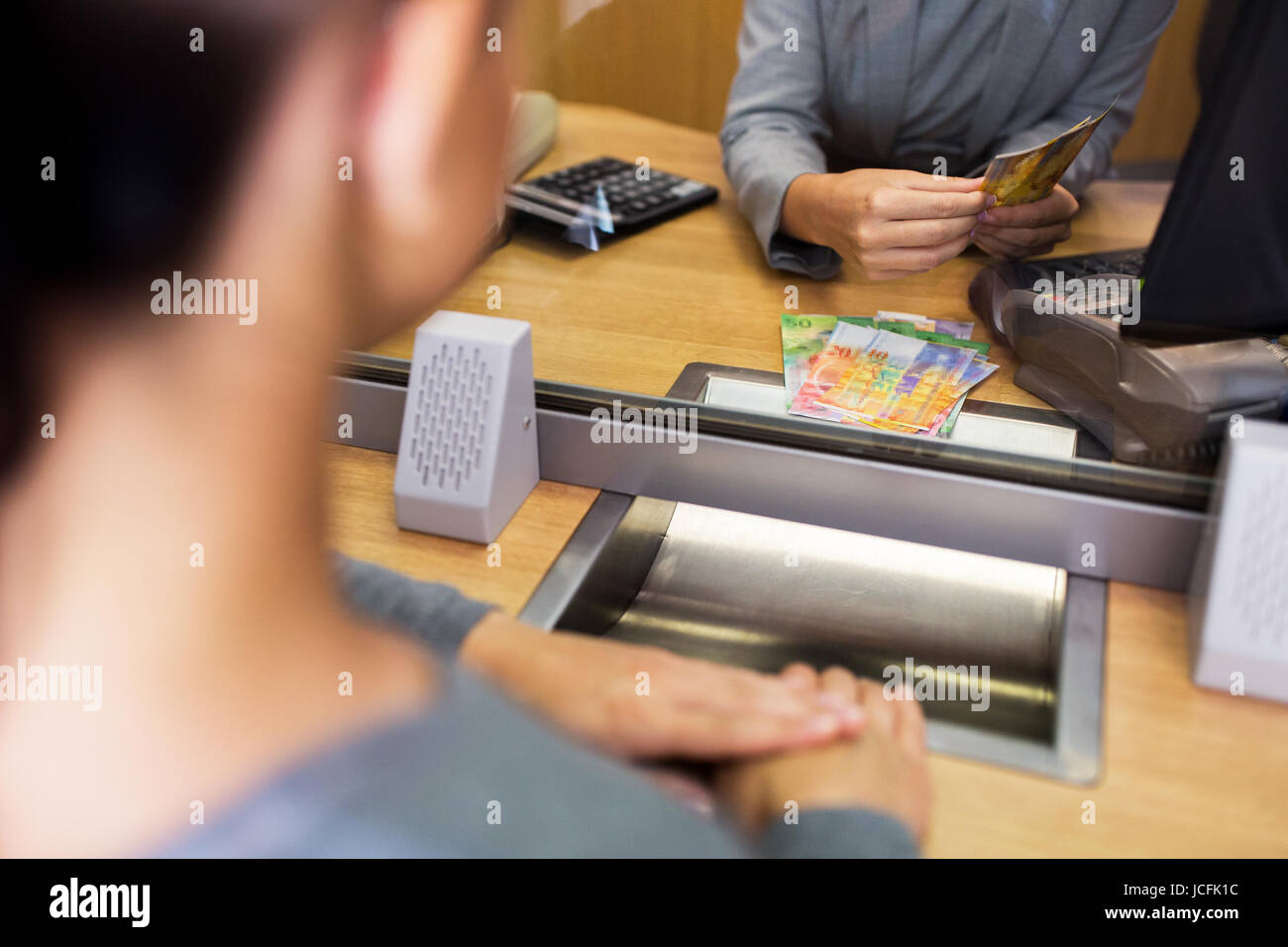 clerk counting cash money at bank office Stock Photo - Alamy