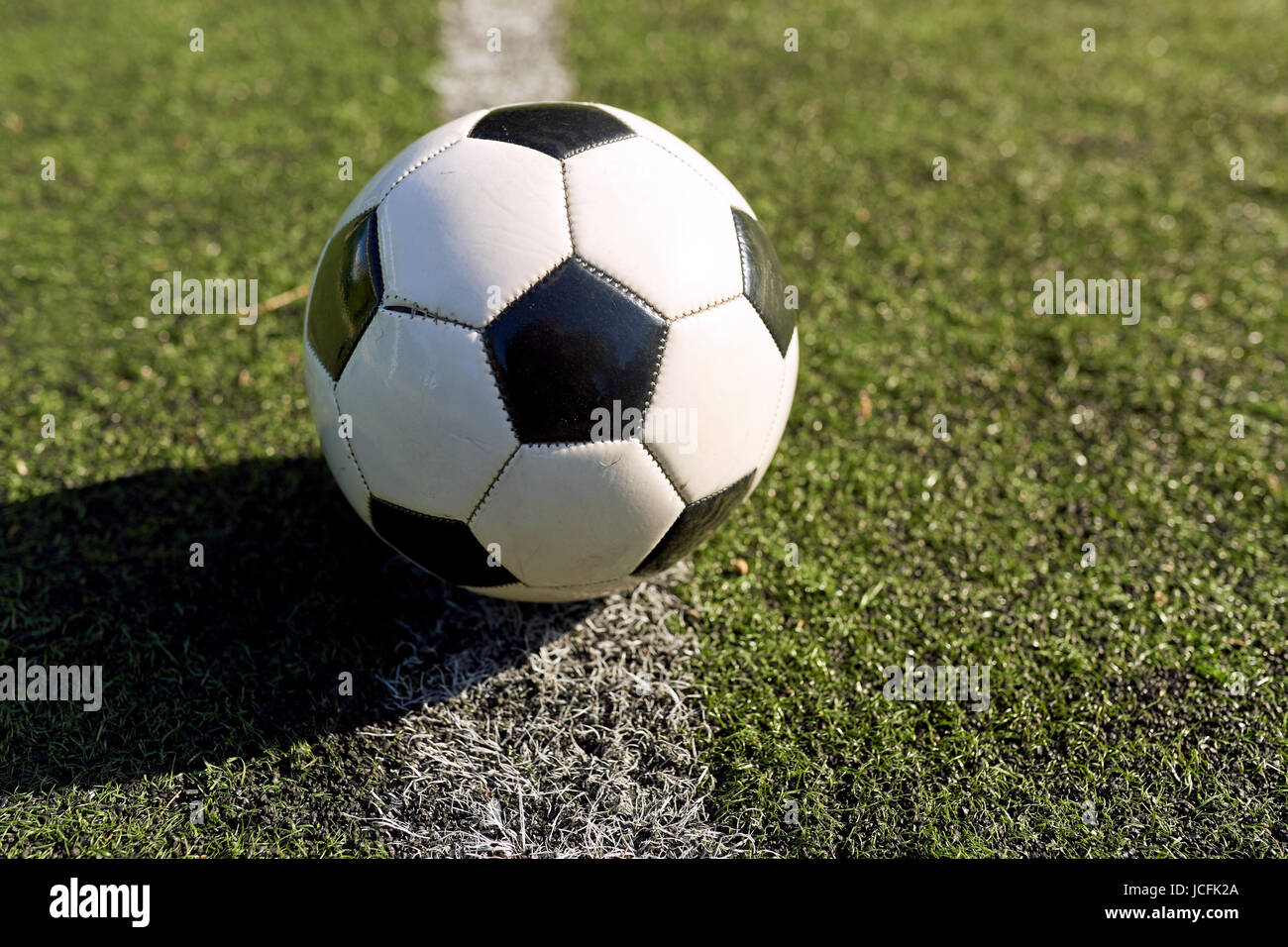 soccer ball on football field marking line Stock Photo - Alamy