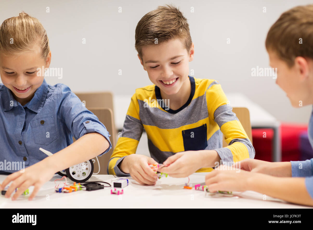 happy children building robots at robotics school Stock Photo - Alamy