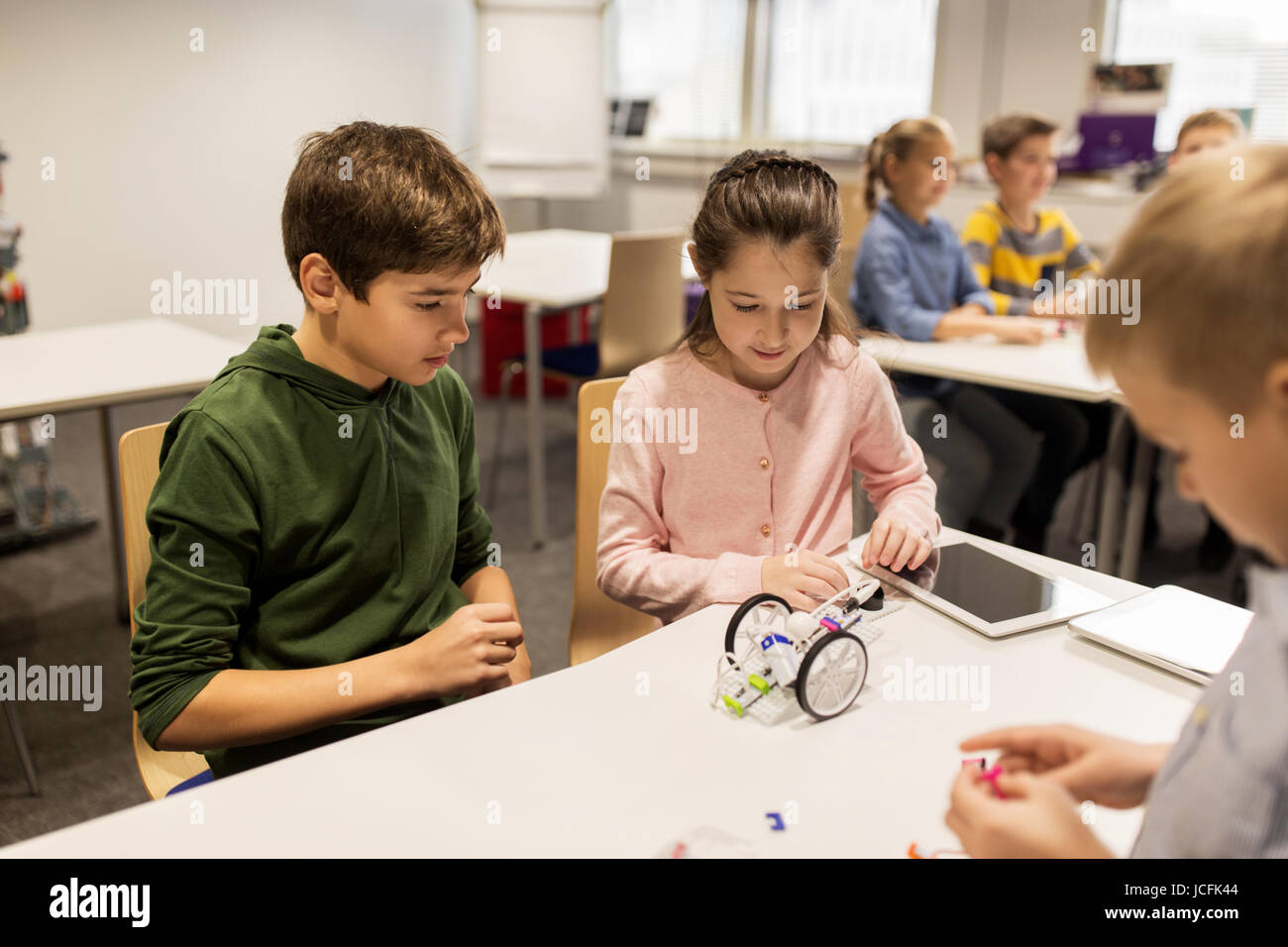 happy children building robots at robotics school Stock Photo - Alamy