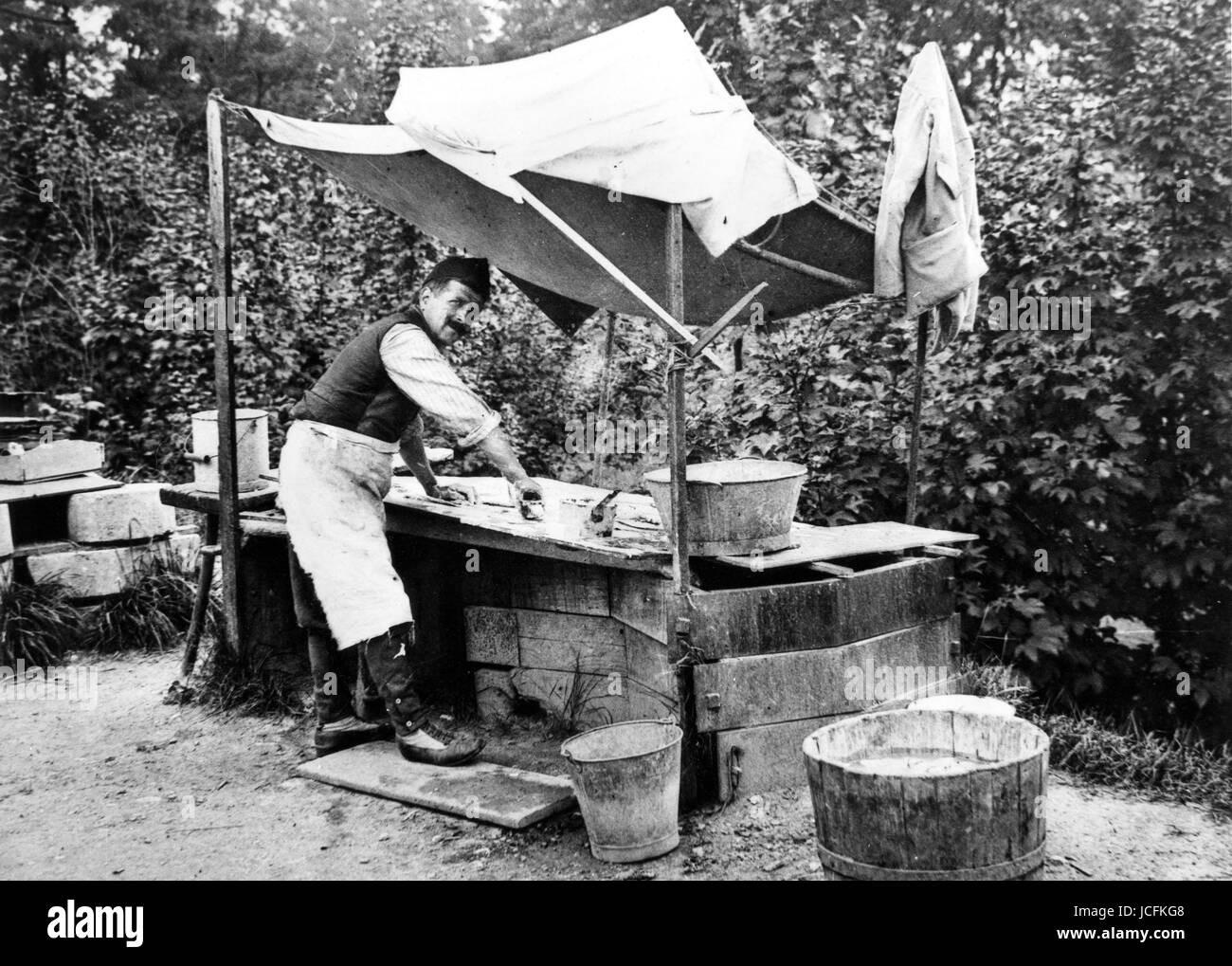 Man doing the washing up Black and White Stock Photos & Images - Alamy