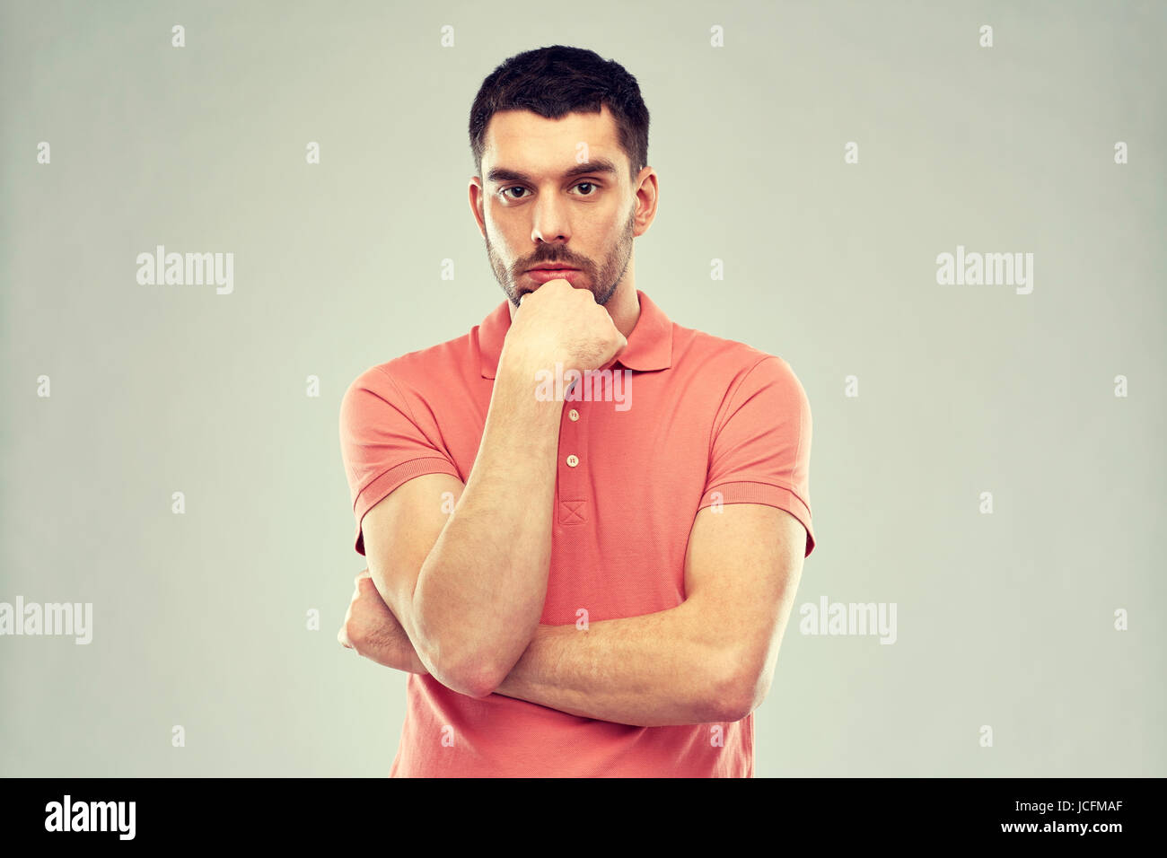 man thinking over gray background Stock Photo - Alamy