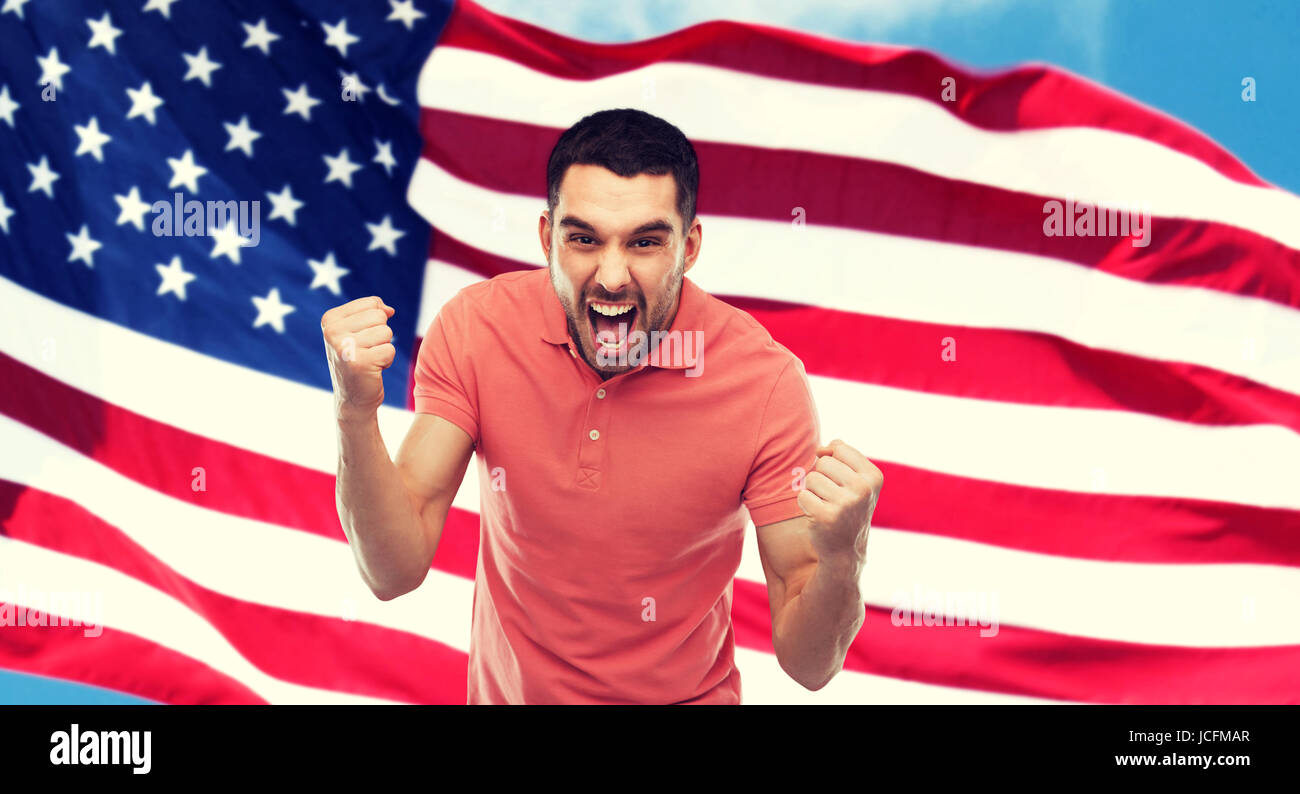 angry man showing fists over american flag Stock Photo - Alamy