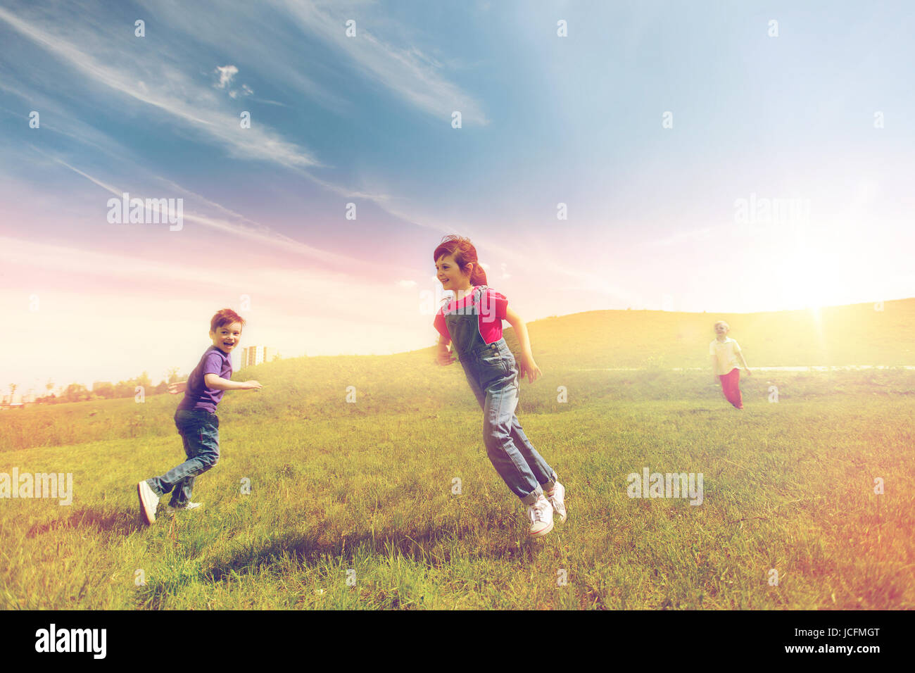 Group happy little kids running hi-res stock photography and images - Alamy