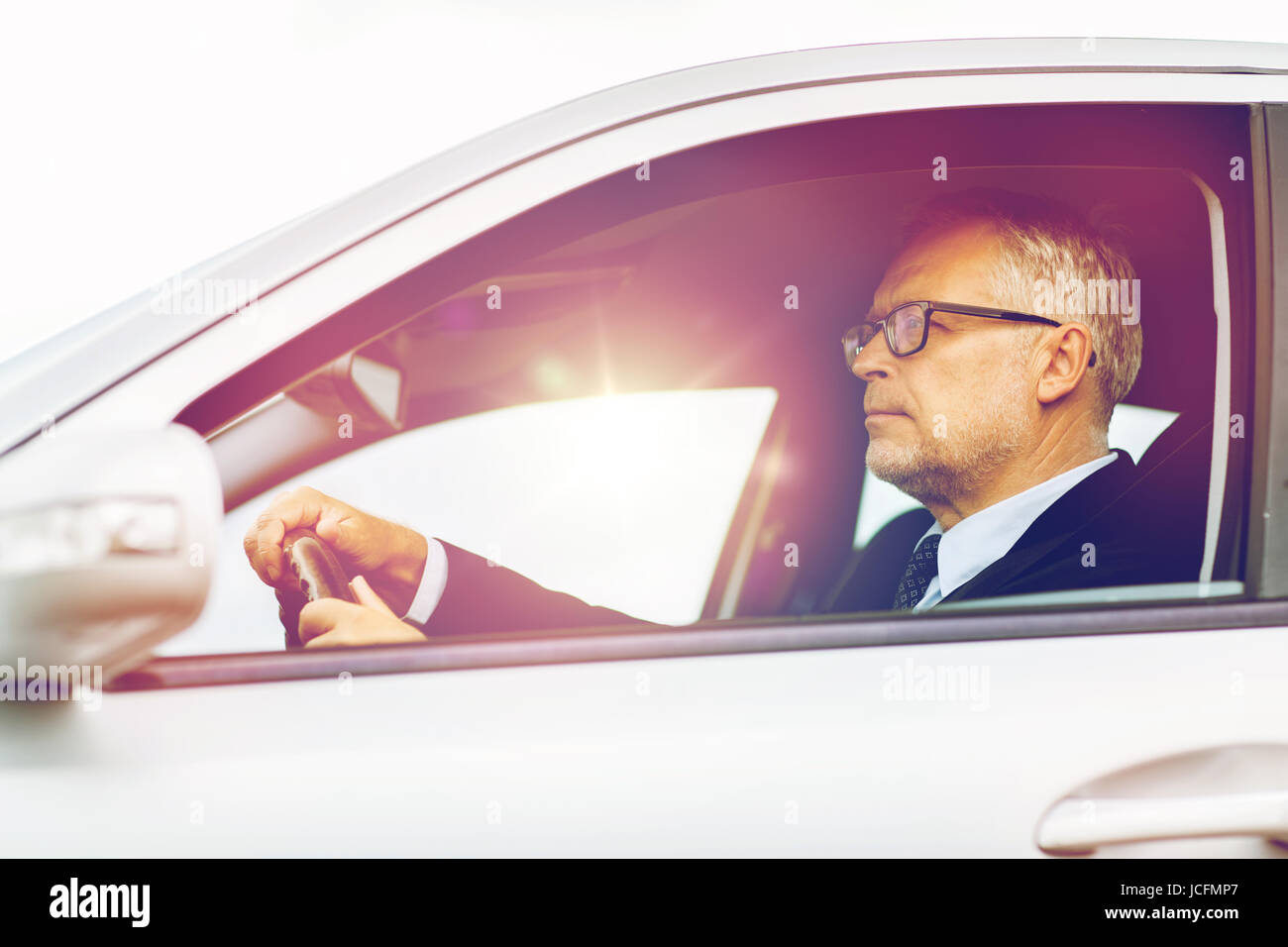 happy senior businessman driving car Stock Photo - Alamy