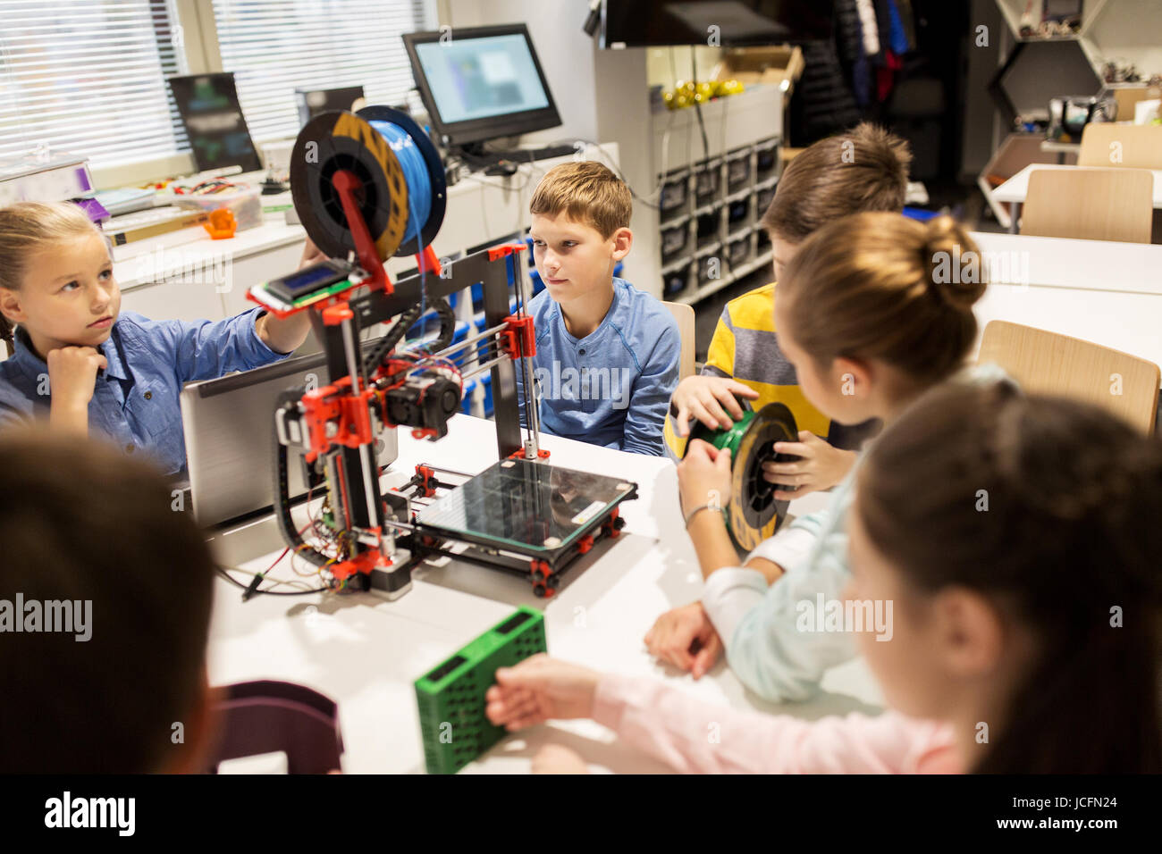 happy children with 3d printer at robotics school Stock Photo - Alamy