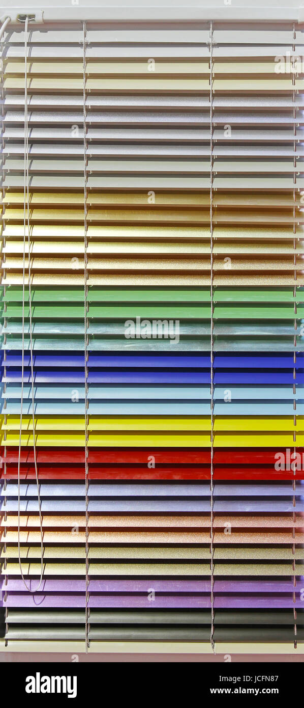 Aluminum window blinds in rainbow colors Stock Photo - Alamy