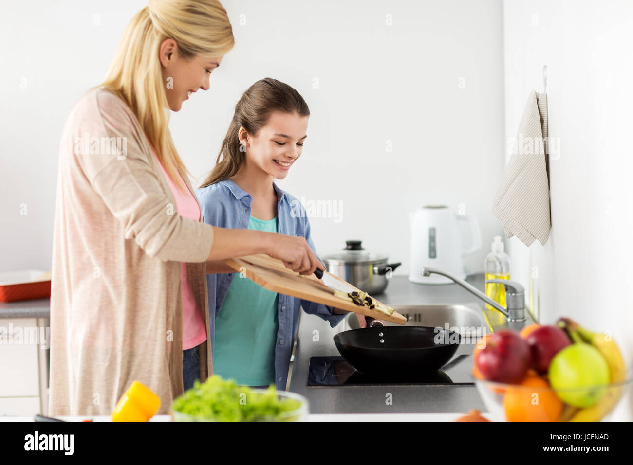 happy family cooking food at home kitchen Stock Photo - Alamy