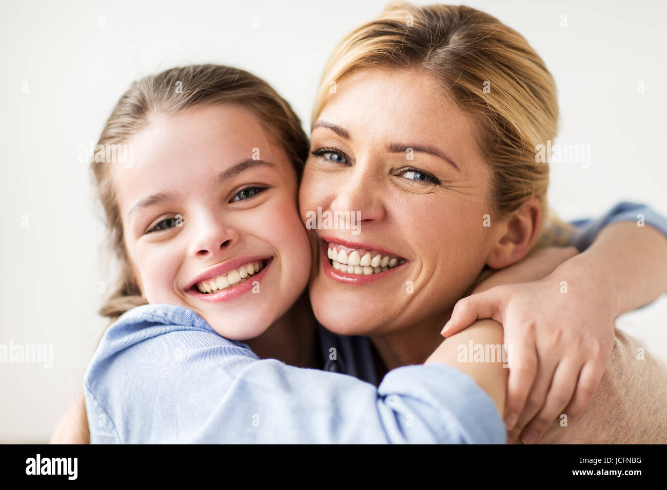 happy smiling family hugging Stock Photo - Alamy