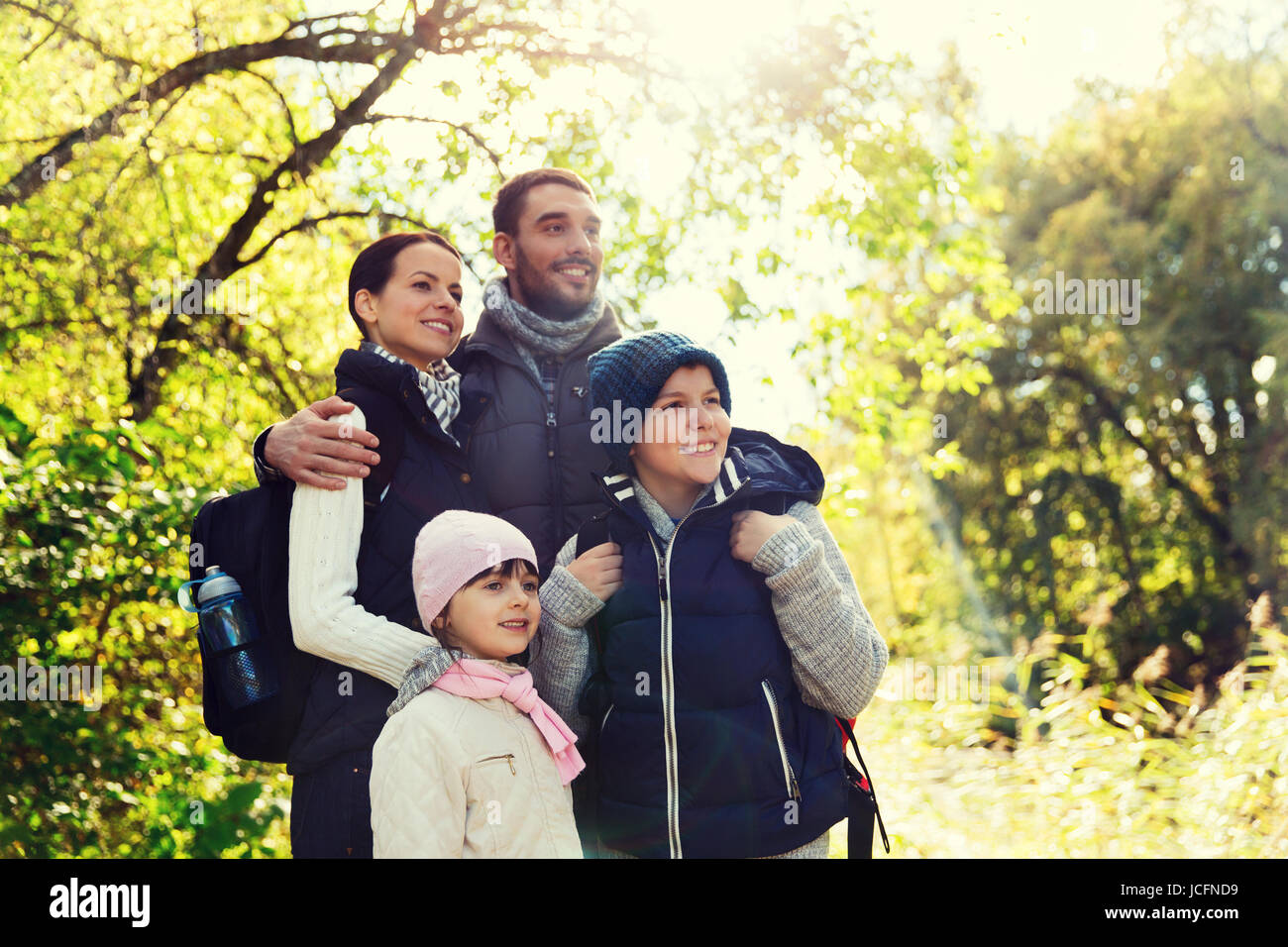 happy family with backpacks hiking Stock Photo - Alamy