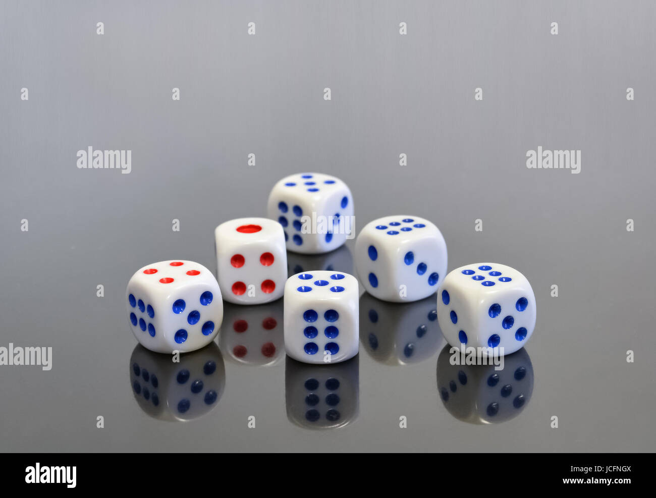 Set of six dices thrown on a gray background Stock Photo - Alamy
