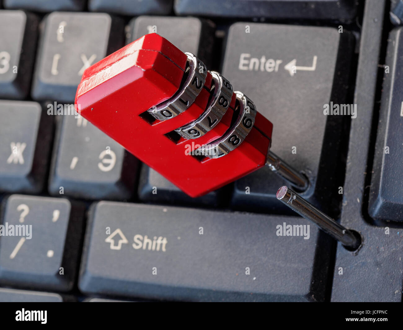 Computer keyboard and combination lock Stock Photo - Alamy