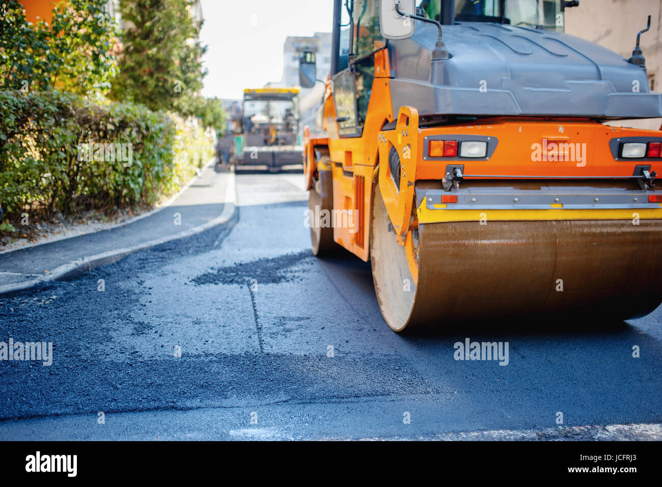 Tandem vibration roller compactor working on asphalt pavement Stock ...