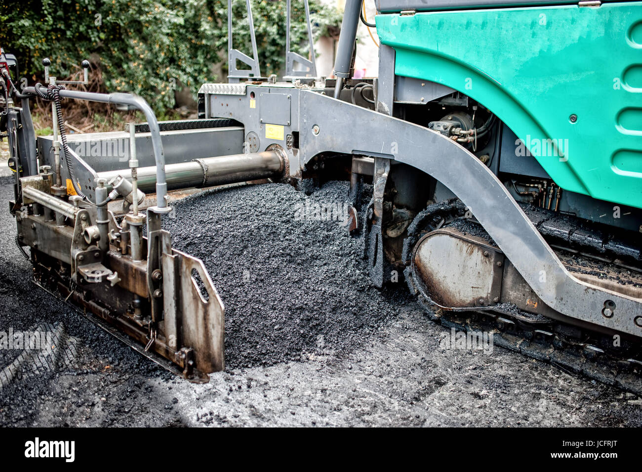 detail of asphalt paver machine during road construction and highway ...