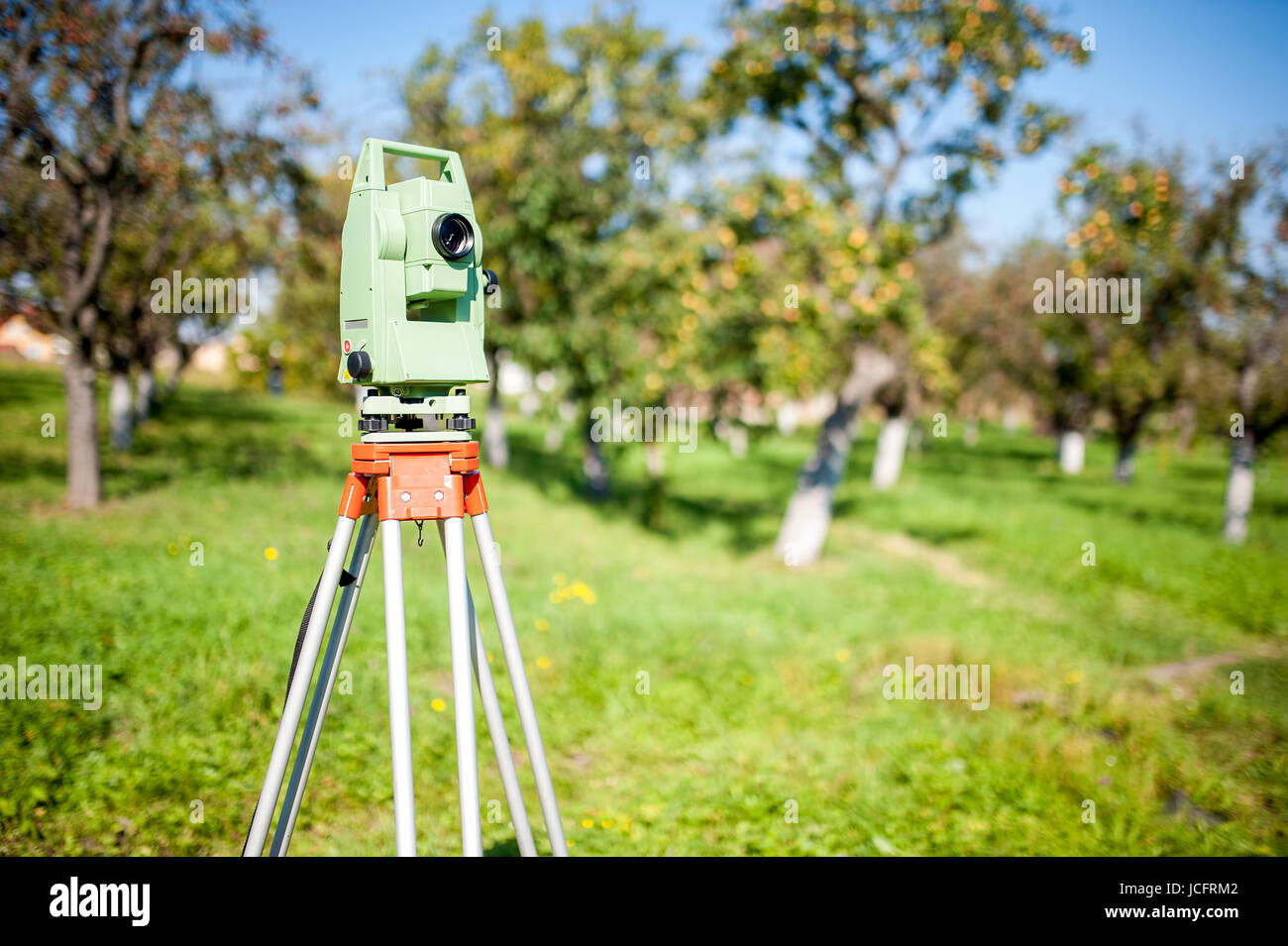 Total station surveying and measuring engineering equipment at work in ...