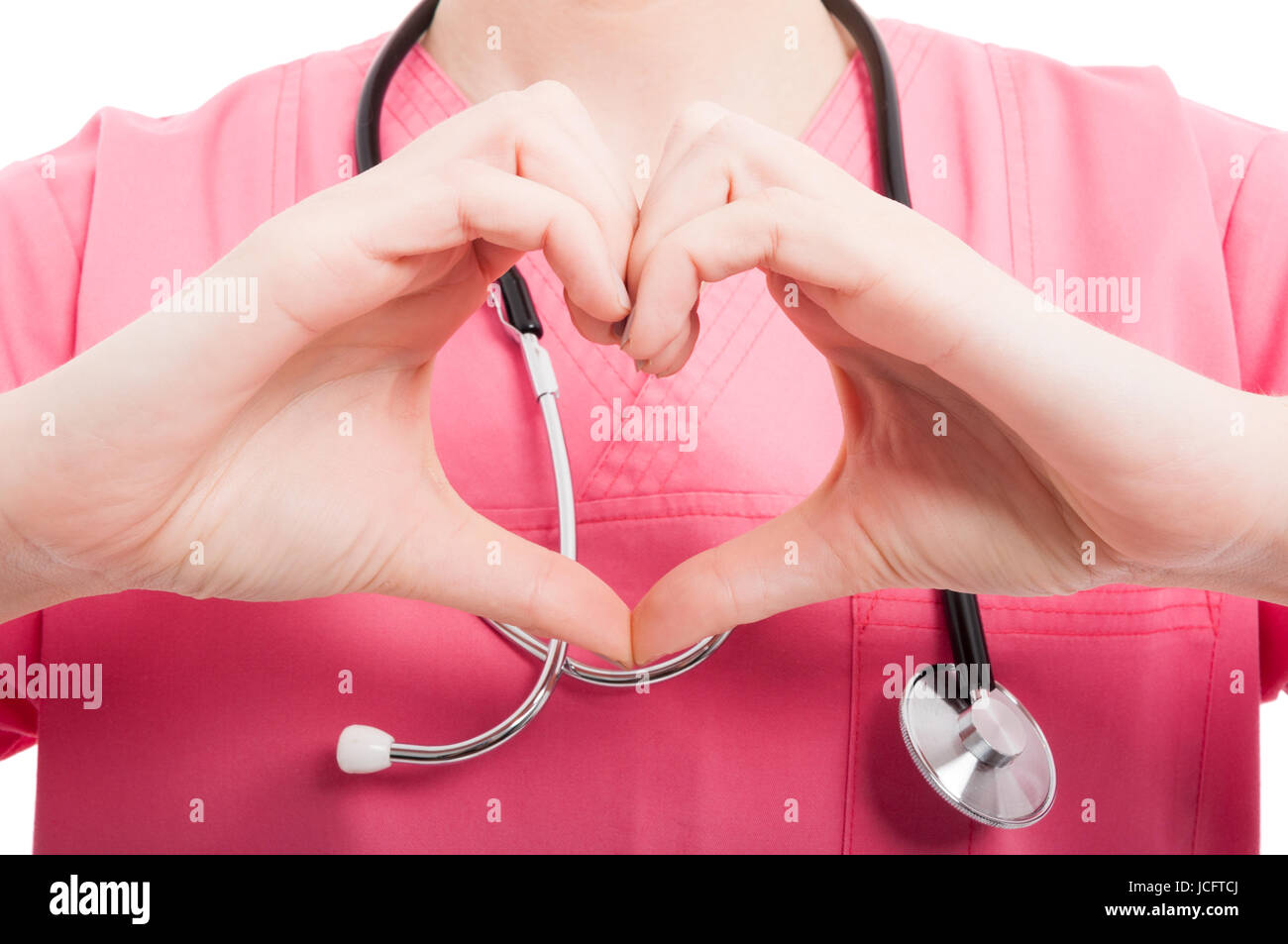 Close-up of female nurse showing heart shape with hands isolated on ...