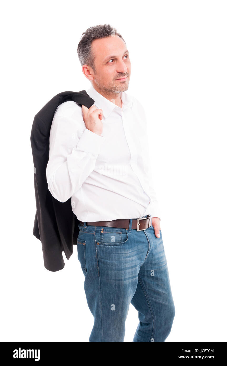 Man holding suit jacket over his shoulder looking away with hand in ...
