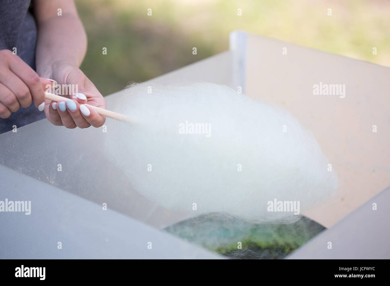 A process of making candy-floss. Cotton candy Stock Photo - Alamy