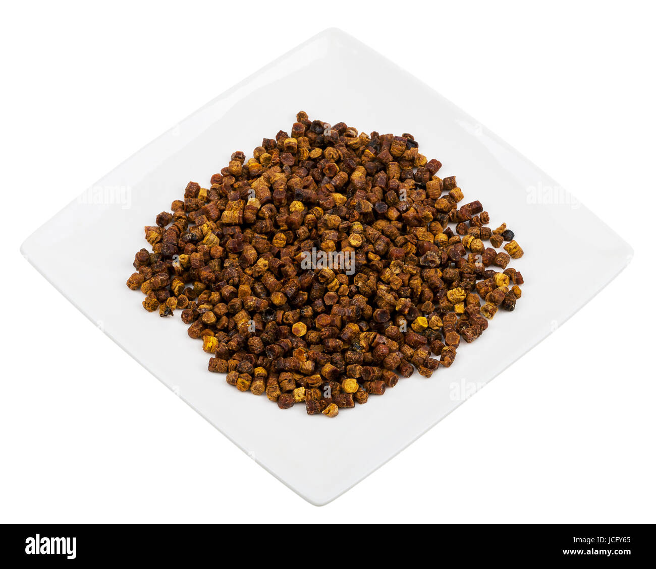 Pile of bee bread in a plate isolated on white background Stock Photo ...