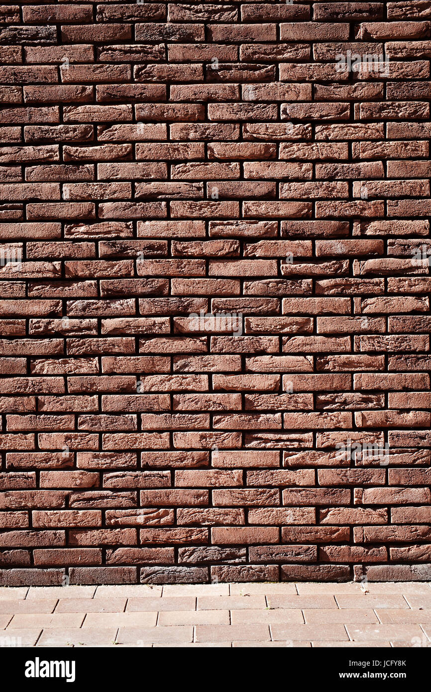 Wall of bricks and a ground Stock Photo - Alamy