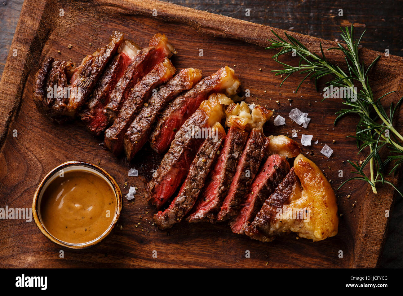 Grilled sliced Steak Striploin with Pepper sauce close-up Stock Photo ...