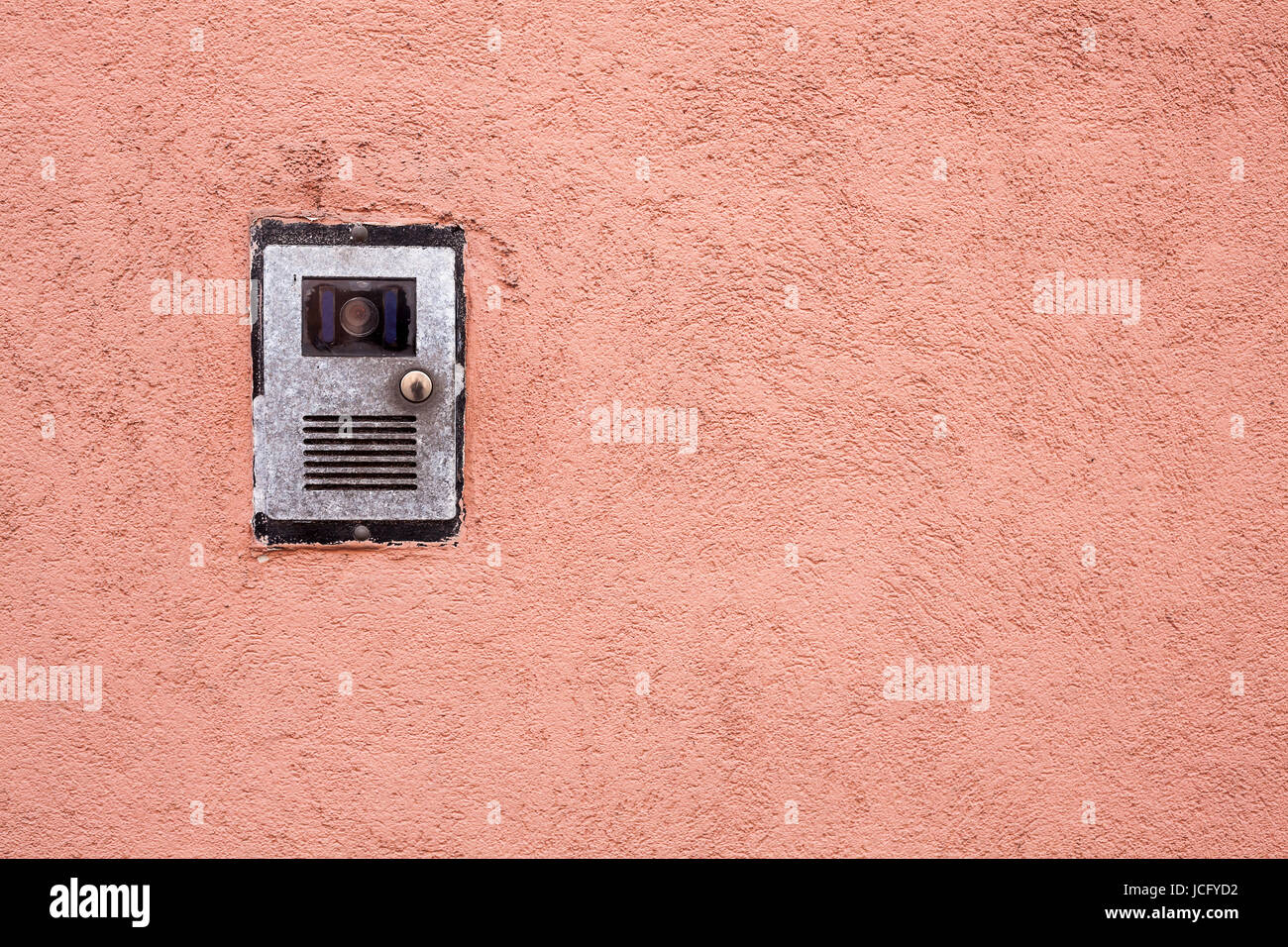 Closeup shot of a intercom on a red wall Stock Photo - Alamy