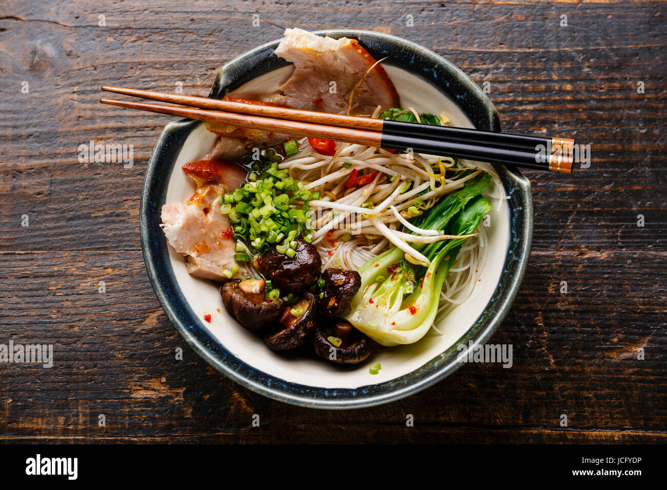 Rice noodles with boiled pork, wheat germ and shiitake mushrooms on ...