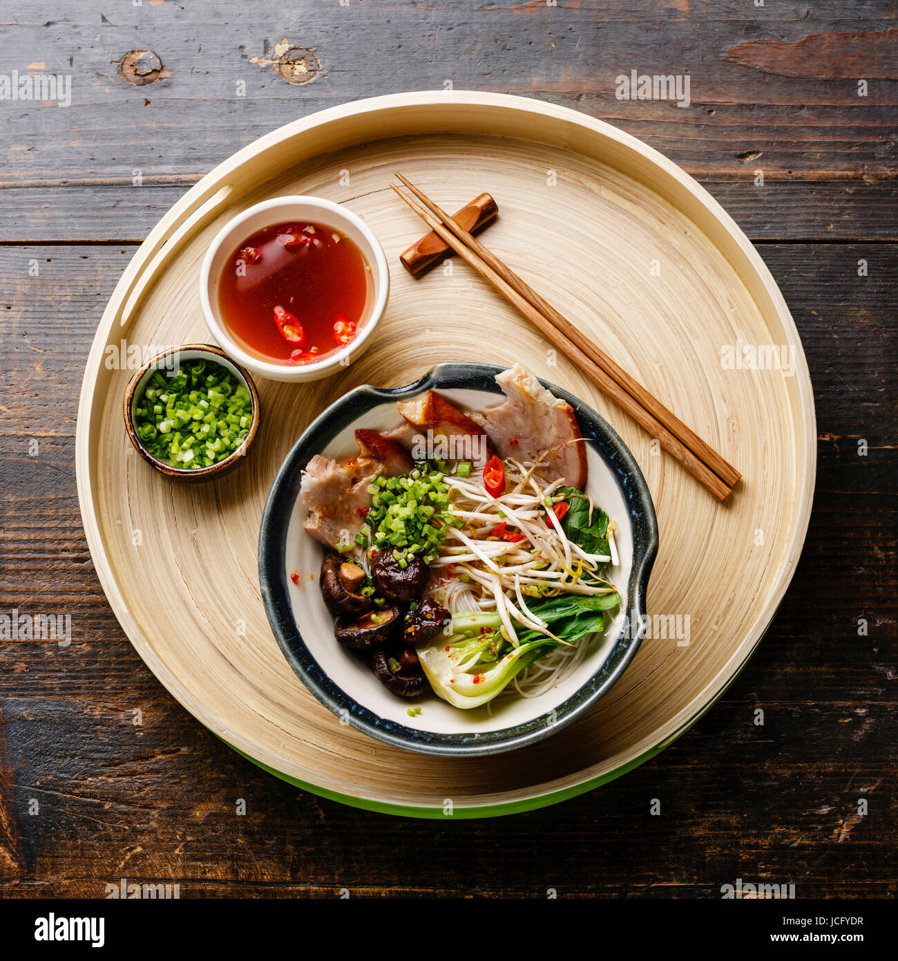 Rice noodles with boiled pork, wheat germ and shiitake mushrooms on ...