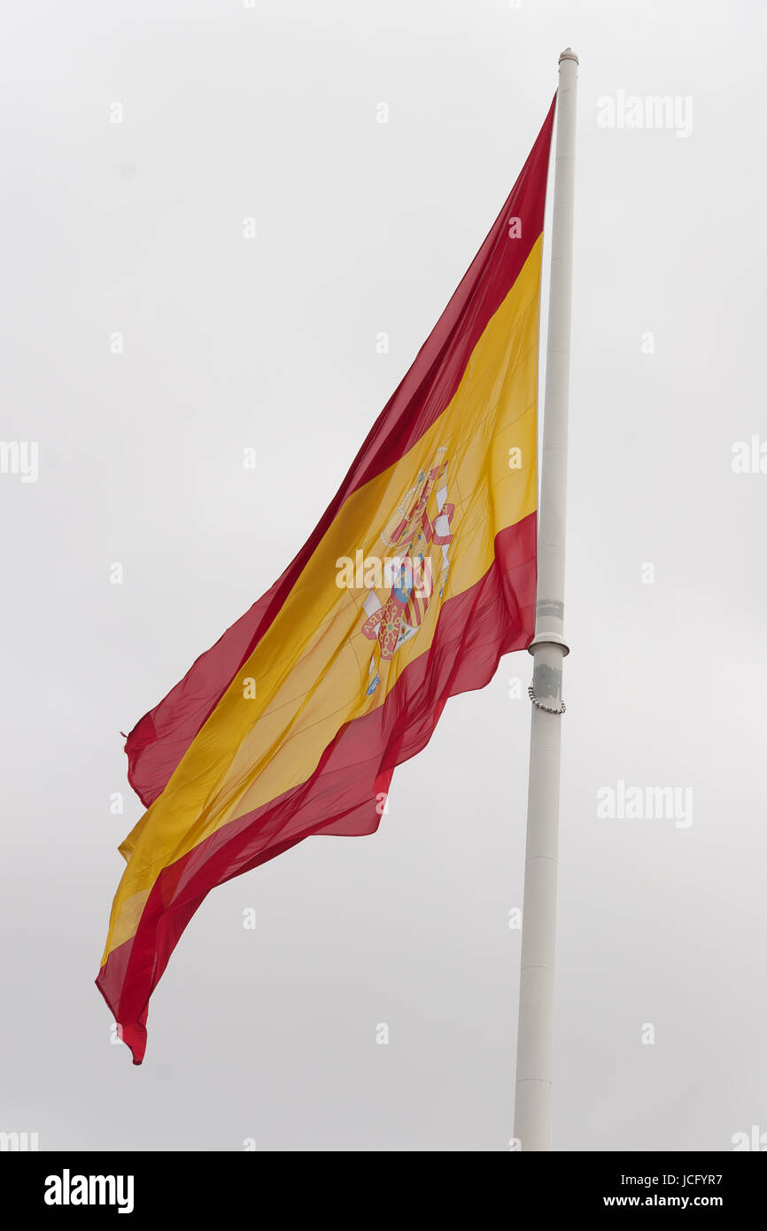 Flying Flag of Spain in Madrid center Stock Photo - Alamy