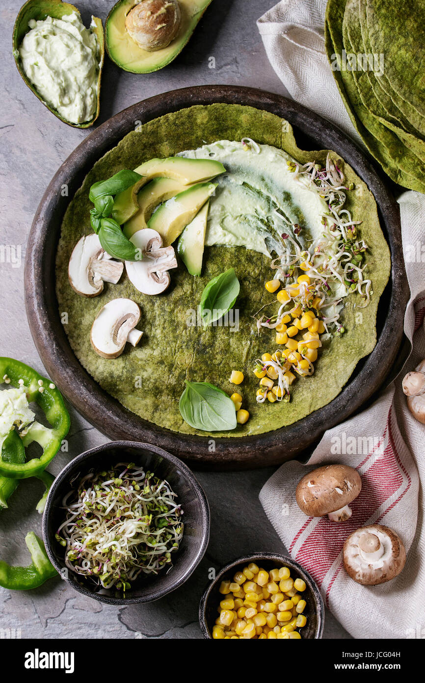 Green spinach matcha tortilla with vegan ingredients for filling. Sweet ...