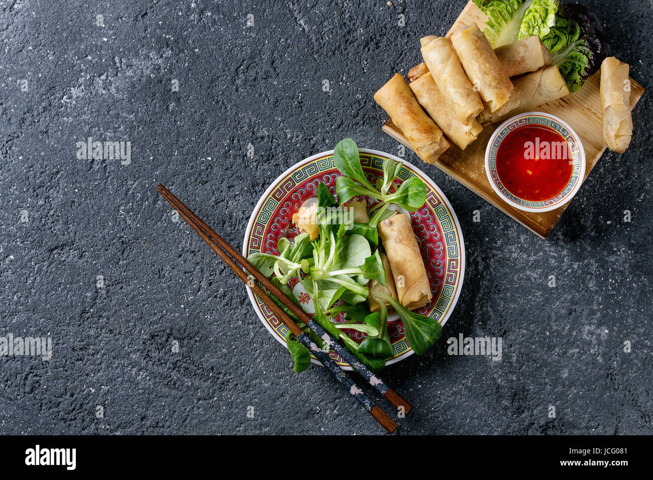 Fried spring rolls with red pepper sauces, served in traditional china ...