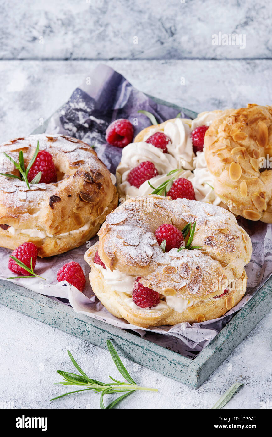 Homemade choux pastry cake Paris Brest with raspberries, almond, sugar ...