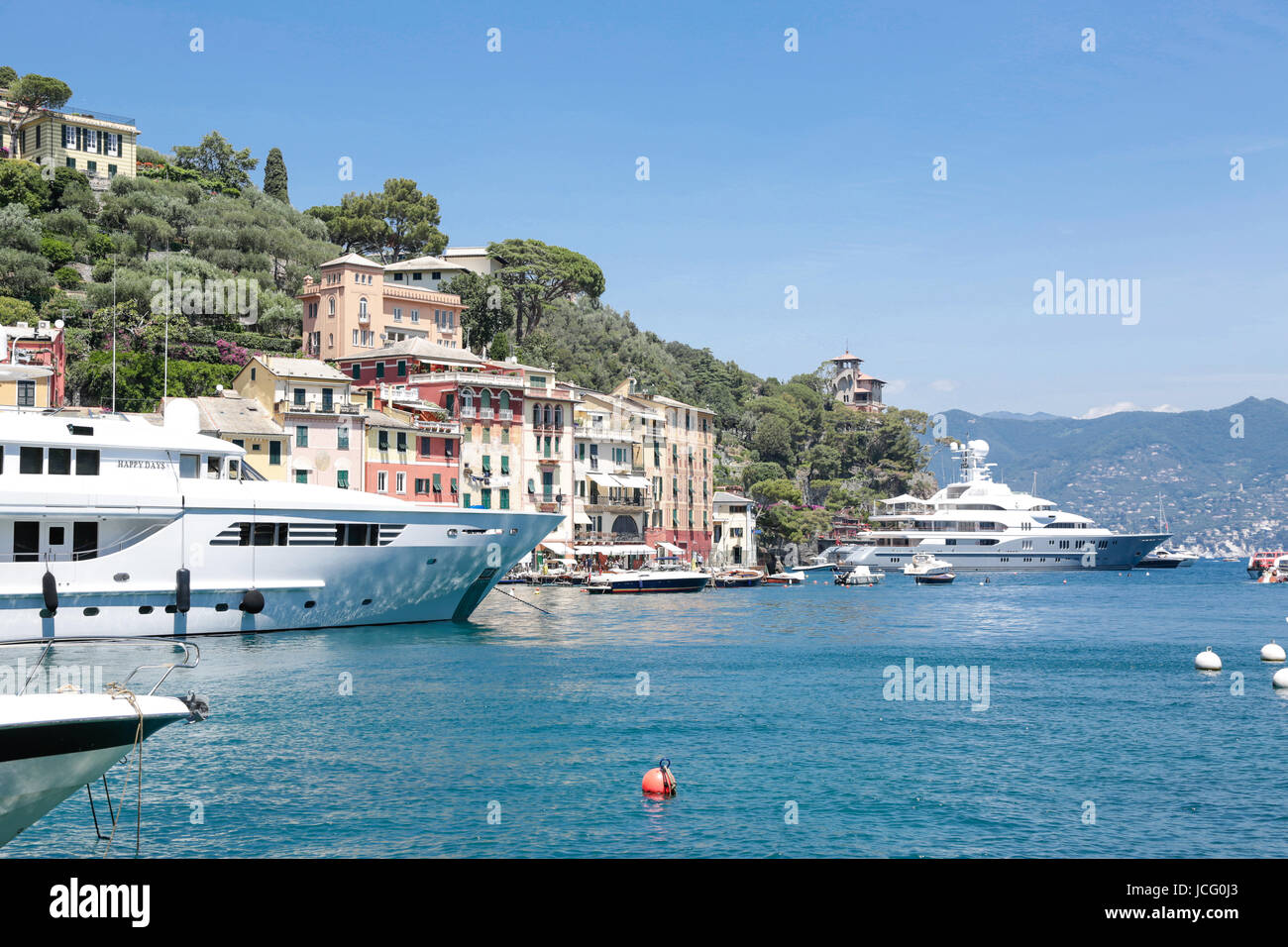 Portofino harbor with colorful historical house in the background ...