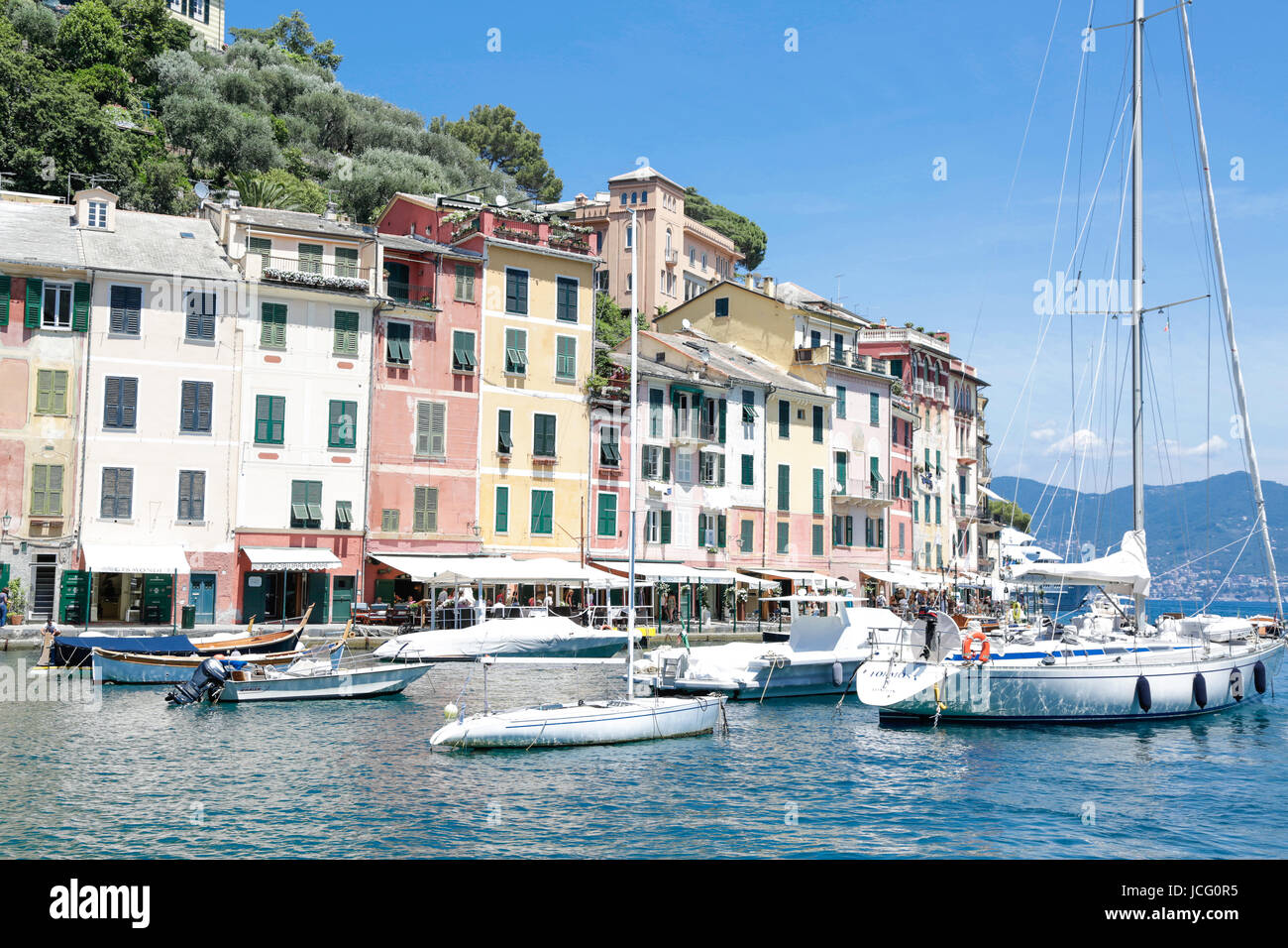 Portofino harbor with colorful historical house in the background ...