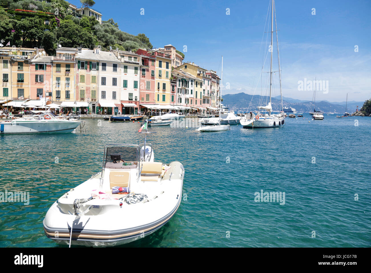 Portofino harbor with colorful historical house in the background ...
