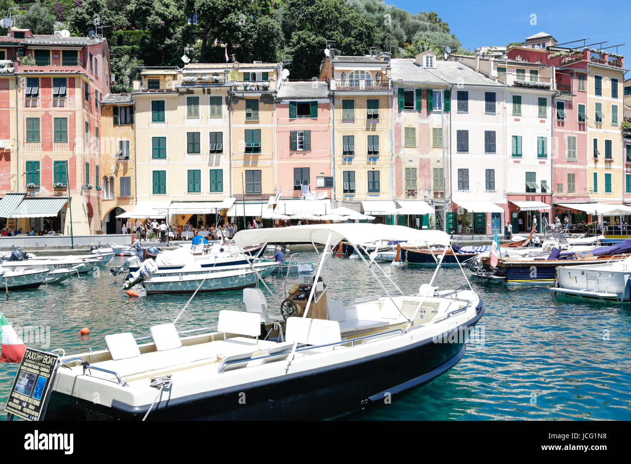 Portofino harbor with colorful historical house in the background ...