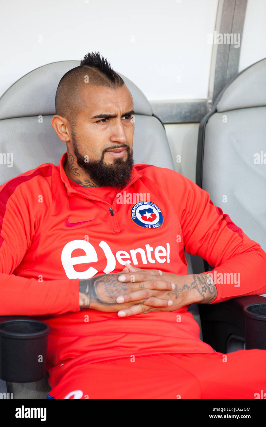 Arturo Vidal (R) of Chile on the bench before Romania vs Chile friendly ...