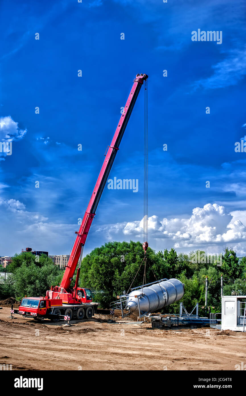 mobile industrial crane installing a concrete and cement production ...