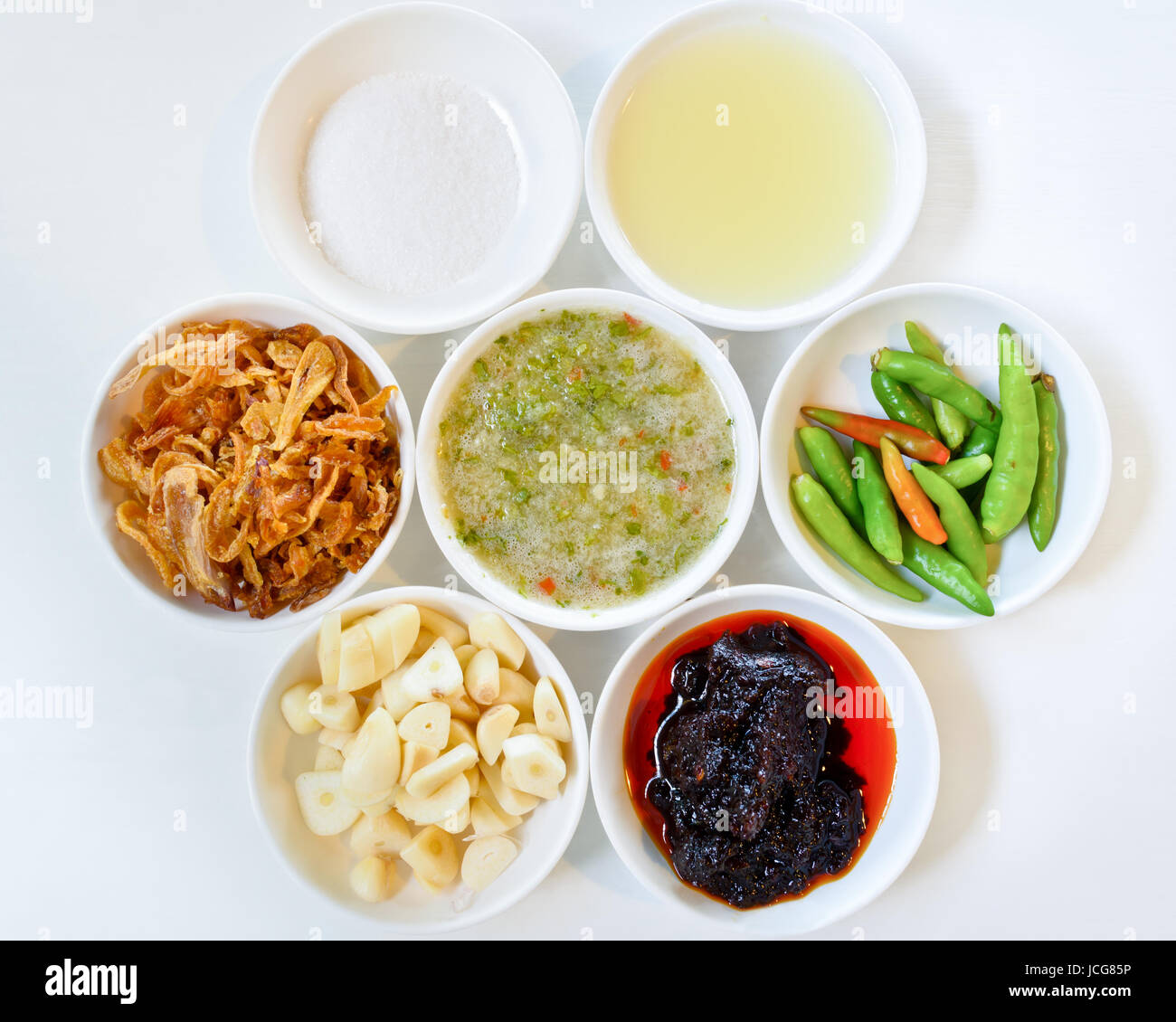 Thai food condiment in a separate small cups Stock Photo - Alamy