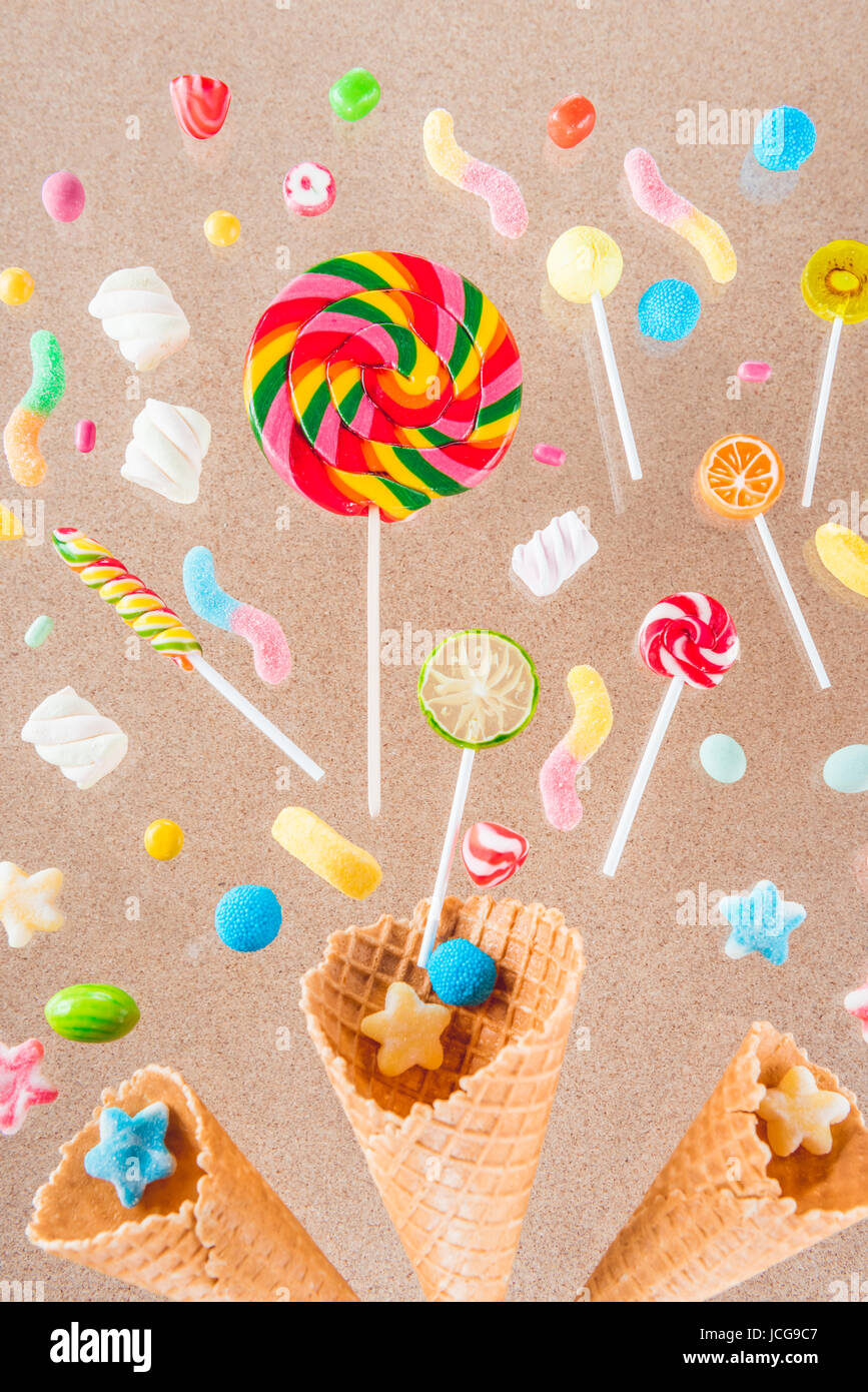 Close-up top view of crispy waffle cones and mix of sweet candies Stock ...
