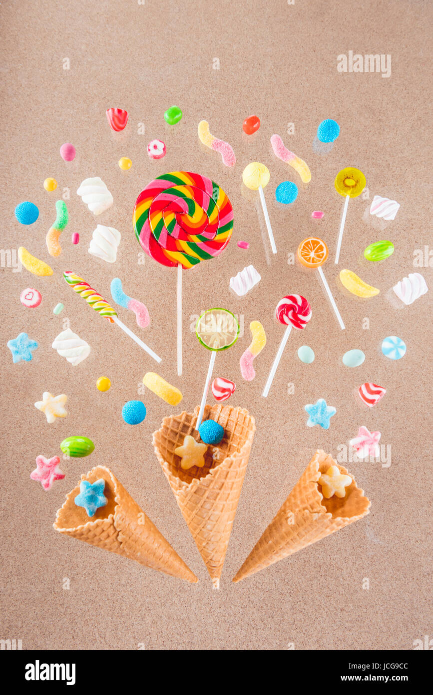 Close-up top view of crispy waffle cones and mix of sweet candies Stock ...