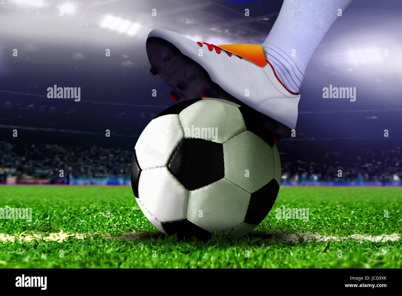 Feet on Soccer Ball in the Stadium Stock Photo - Alamy