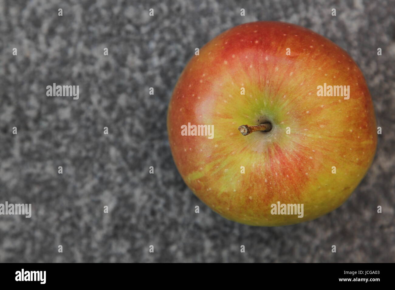 Apple on Stone background Stock Photo - Alamy